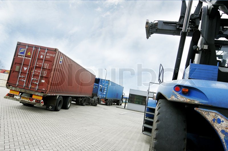 Two trucks loaded with containers | Stock image | Colourbox