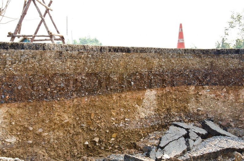 Layer of soil beneath the asphalt road. | Stock image | Colourbox