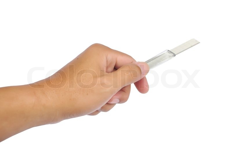 Hand holding cutting knife tool | Stock image | Colourbox