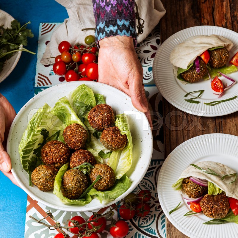 Hands Holding Plate Of Food