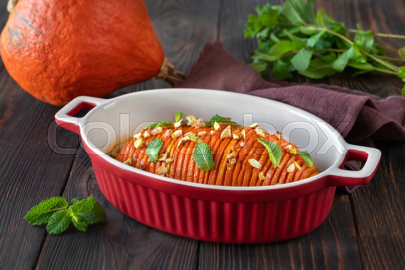 Baked hasselback pumpkin glazed with ... | Stock image | Colourbox