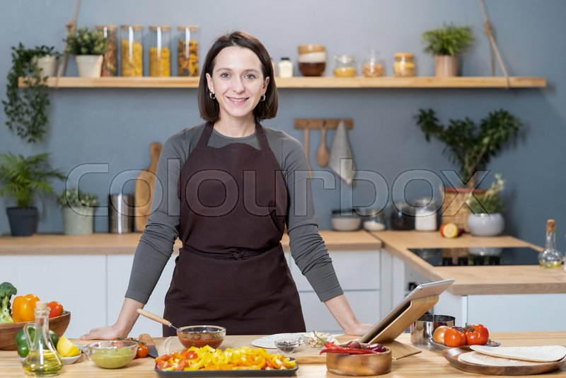 Woman In Kitchen Standing
