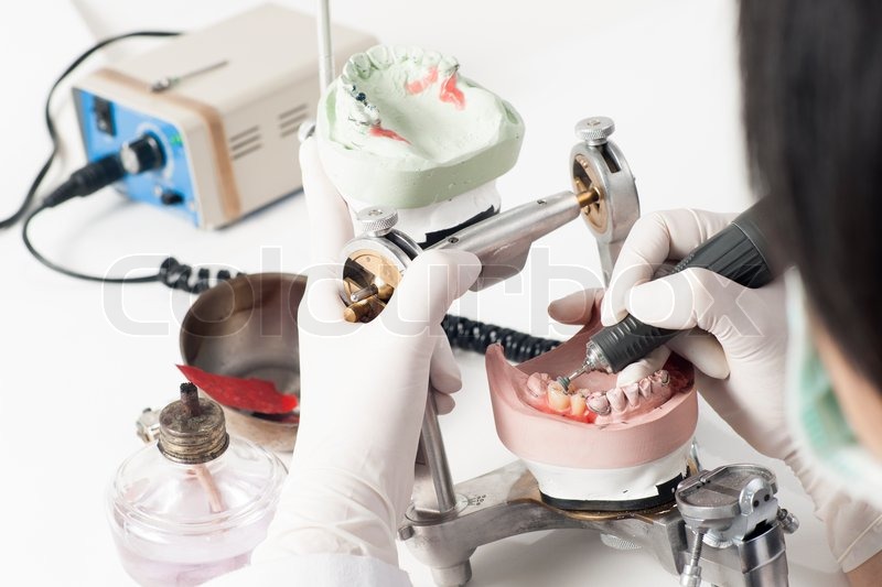 Dental technician working with ... | Stock image | Colourbox