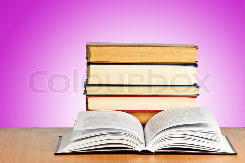Open book on desk | Stock Photo | Colourbox