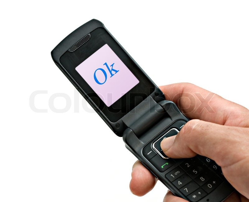 Mobile phone with "Ok" shown on its ... | Stock Photo | Colourbox