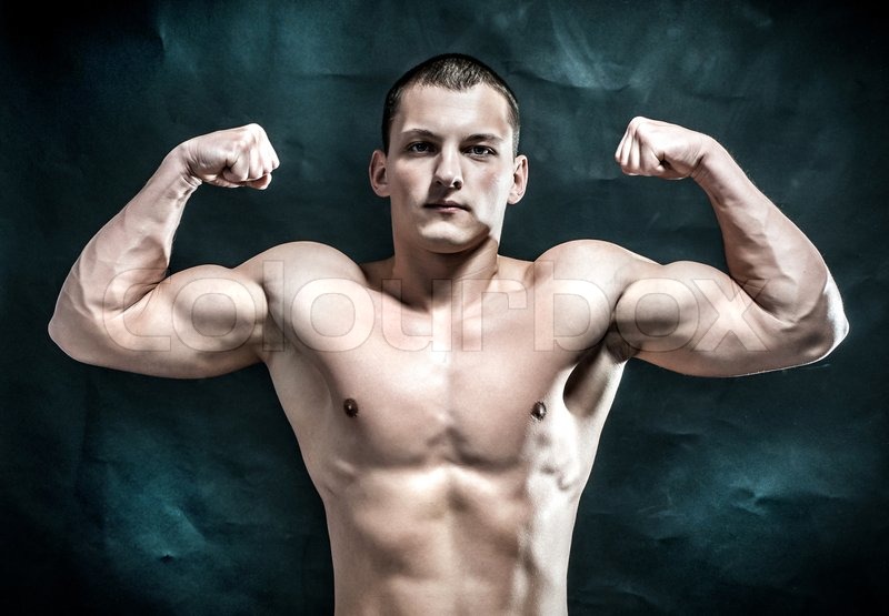 Handsome muscular man on dark ... | Stock image | Colourbox