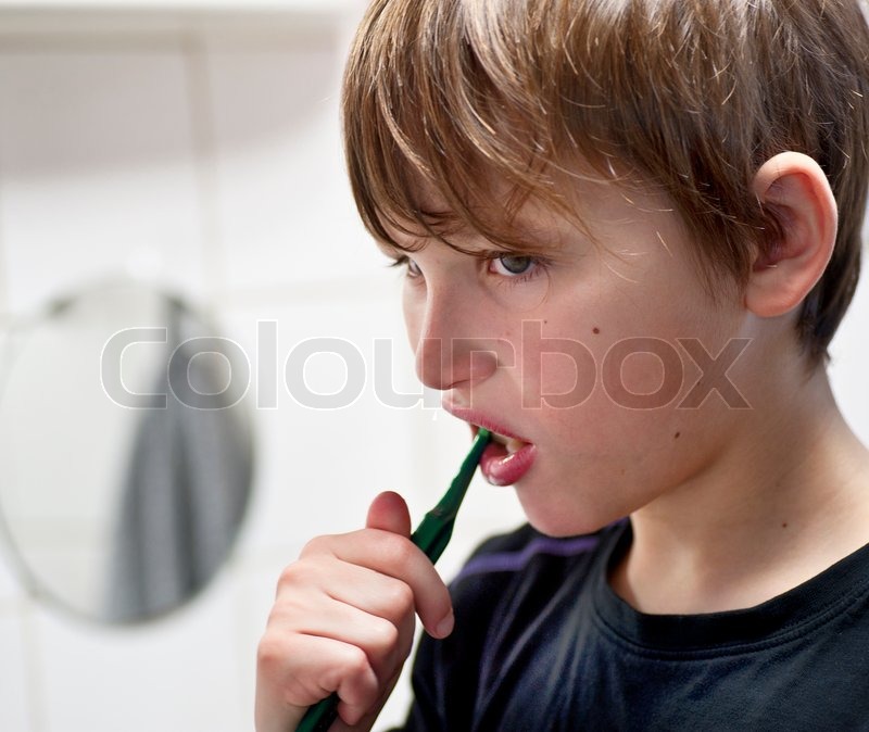 Teenage Boy Brushing Teeth
