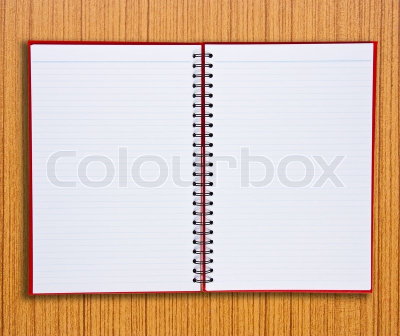 Red notebook open on wooden background | Stock image | Colourbox