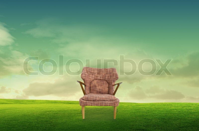 Chair on the green grass and sky | Stock image | Colourbox