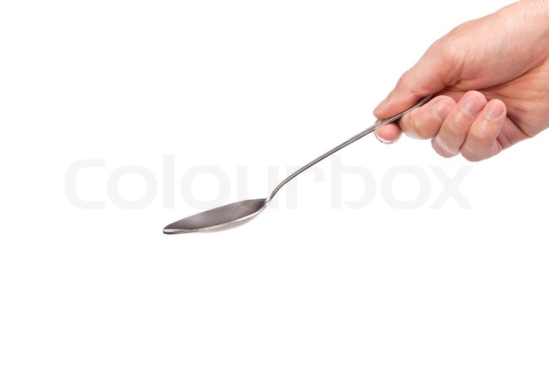 Hand is holding a spoon isolated | Stock image | Colourbox
