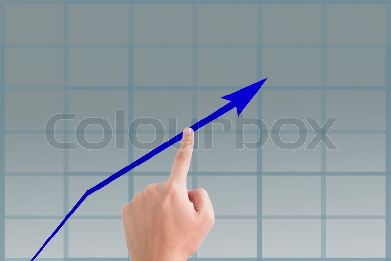 Business man pointing a growing graph ... | Stock image | Colourbox