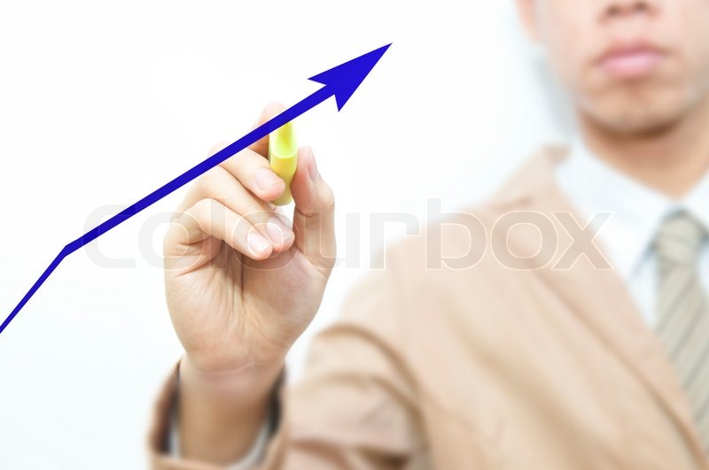 Business man pointing a growing graph ... | Stock image | Colourbox