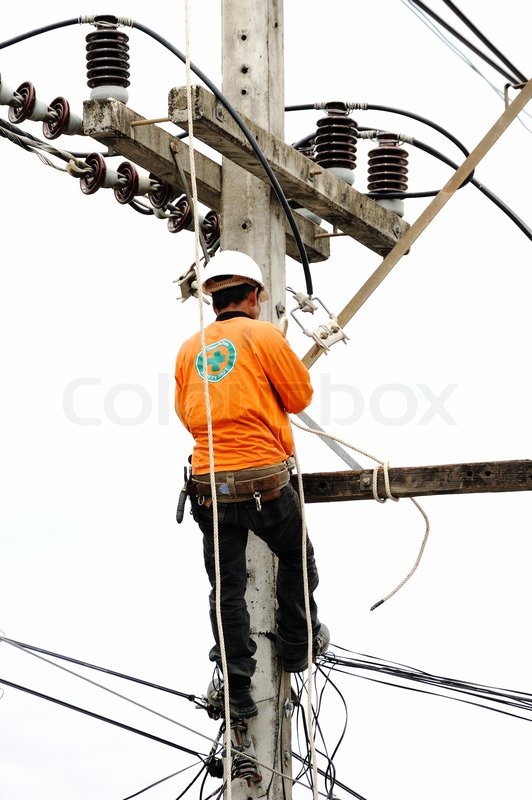 Electrician Man on electric poles | Stock Photo | Colourbox