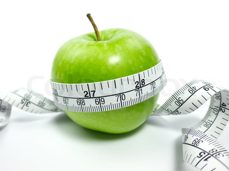 Green apple with measuring tape over ... | Stock image | Colourbox
