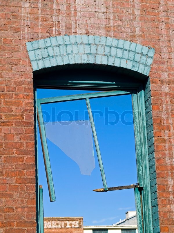 Brick wall and broken window at a ... | Stock image | Colourbox