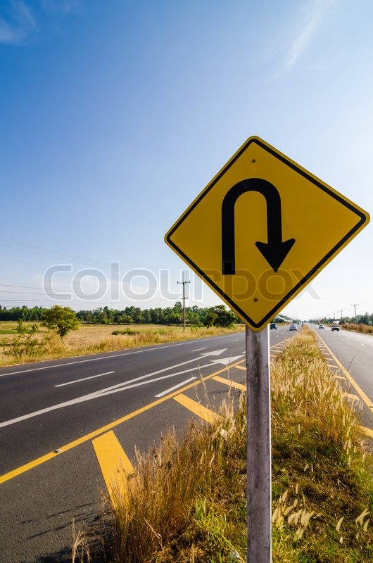U-turn symbol Road in rustic city | Stock image | Colourbox