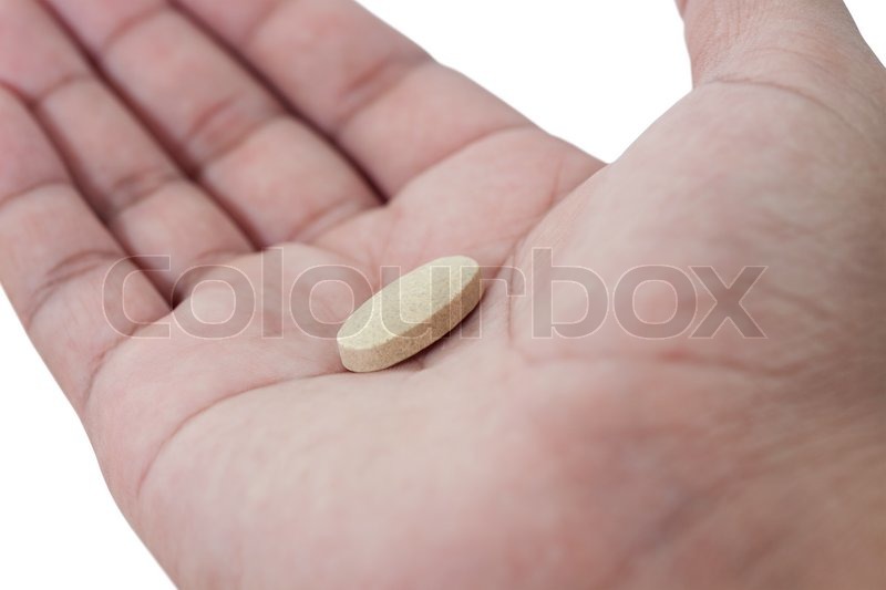 Pill in a hand | Stock image | Colourbox
