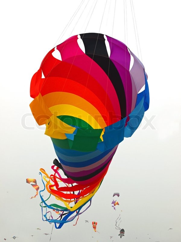 Rainbow Colored Tube Kite Flying on an ... | Stock Photo | Colourbox