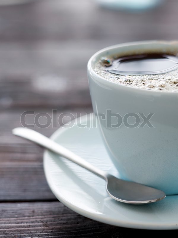 Nærbillede af en kaffekop med en ske ... | Stock foto | Colourbox