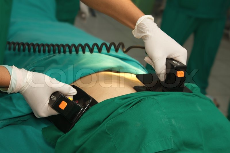 Defibrillator practice on a CPR | Stock image | Colourbox