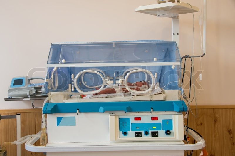 Newborn baby in an incubator | Stock image | Colourbox