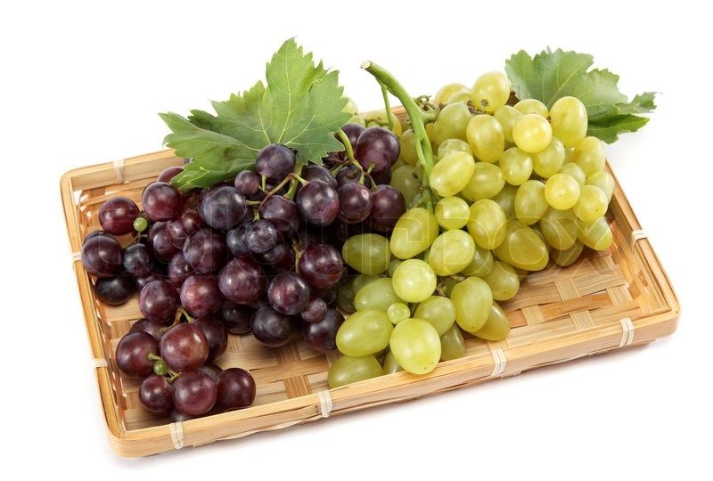 Fresh grape fruits with green leaves ... | Stock image | Colourbox