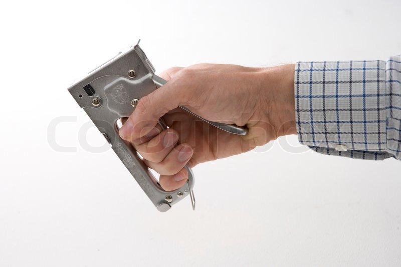 A man holding a staple gun | Stock image | Colourbox