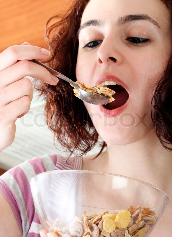 Young people eating milk with cereals | Stock Photo | Colourbox