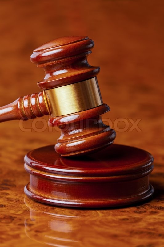 The gavel of a judge in court. lying on ... | Stock image | Colourbox