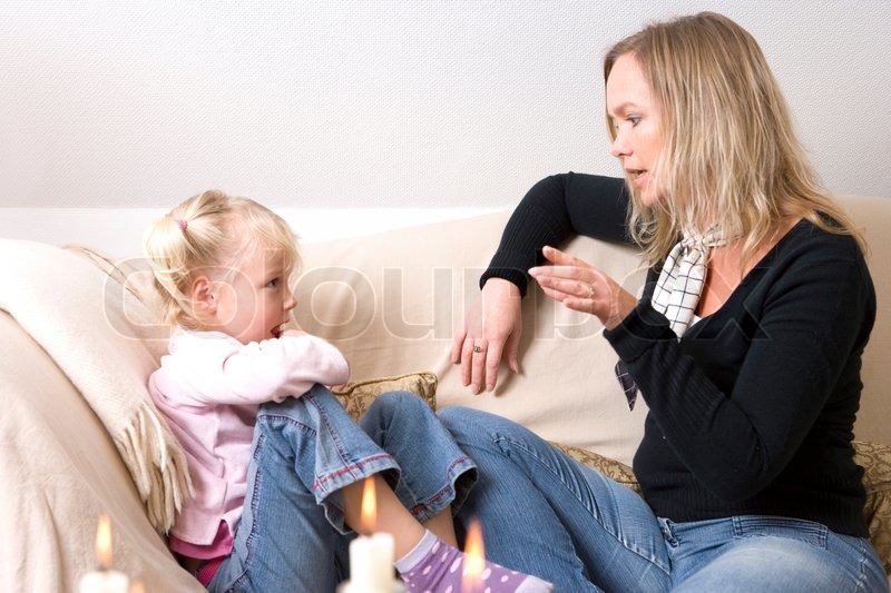 A caucasian mother telling a story to ... | Stock image | Colourbox
