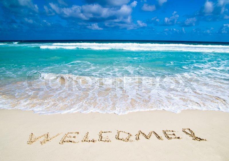Welcome written in a sandy tropical ... | Stock image | Colourbox