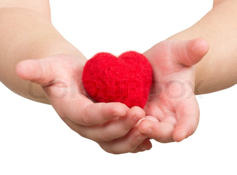 Child's hand with a red heart | Stock image | Colourbox