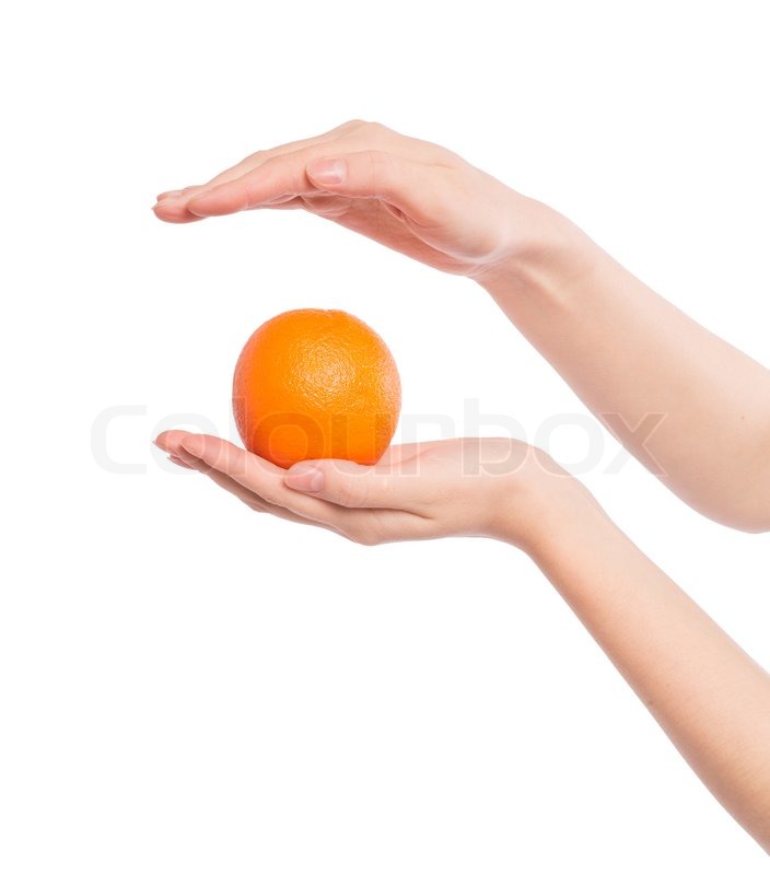 Orange in the hands | Stock Photo | Colourbox