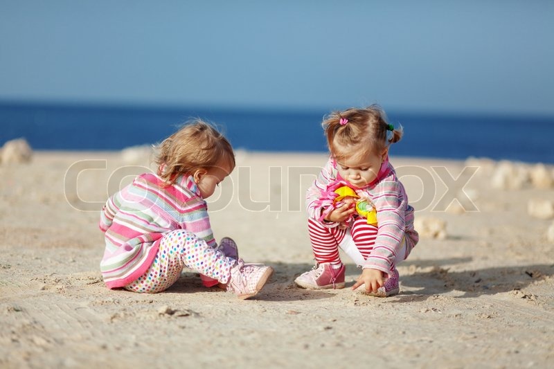 Child walking at the beach | Stock image | Colourbox