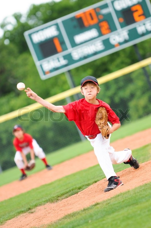 Pitcher throwing the ball to the batter ... | Stock image | Colourbox