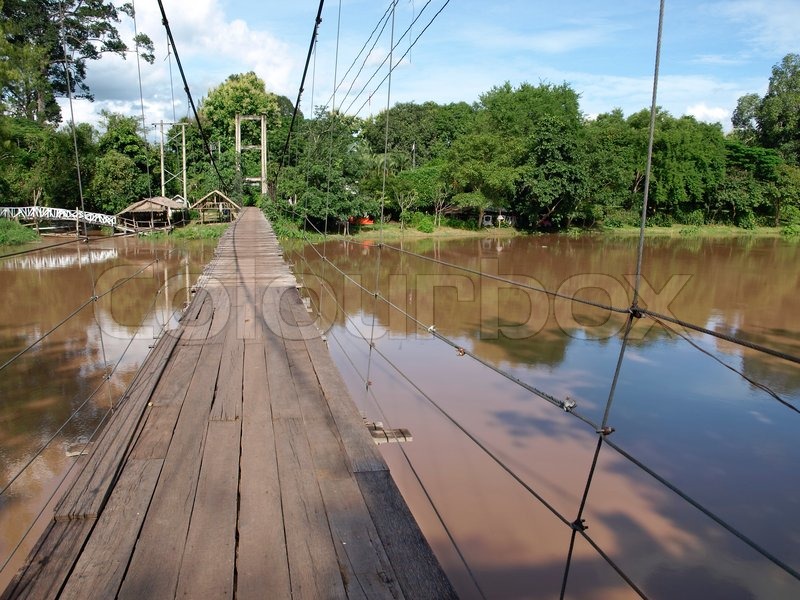 Old rope bridge in the countryside. | Stock image | Colourbox