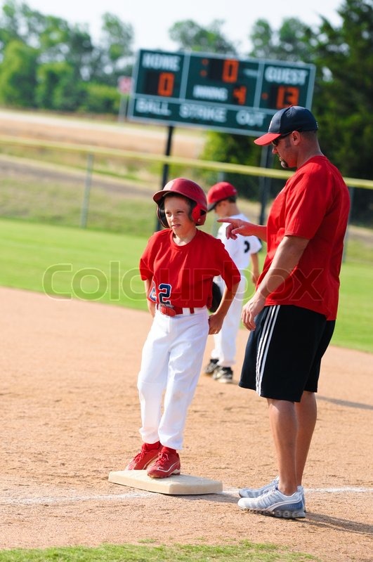 Baseball coach giving instruction to ... | Stock image | Colourbox