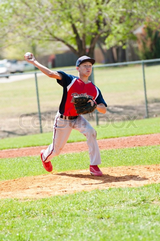 Teen baseball pitcher throwing the ... | Stock image | Colourbox