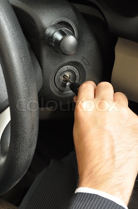 Businessman starting the car | Stock image | Colourbox