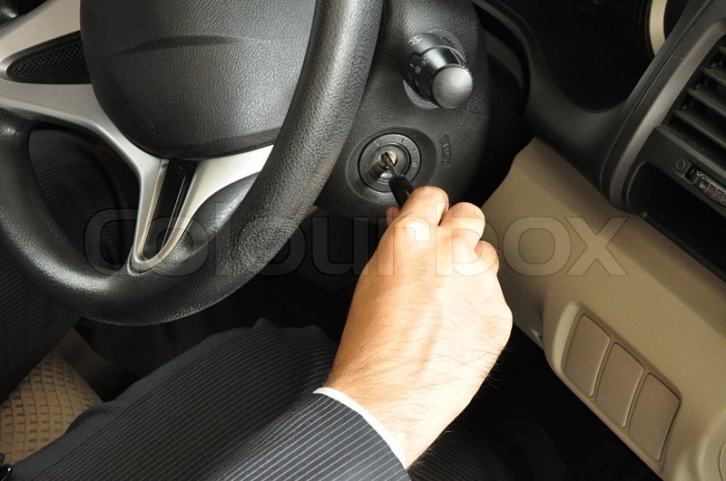 Businessman starting the car | Stock image | Colourbox