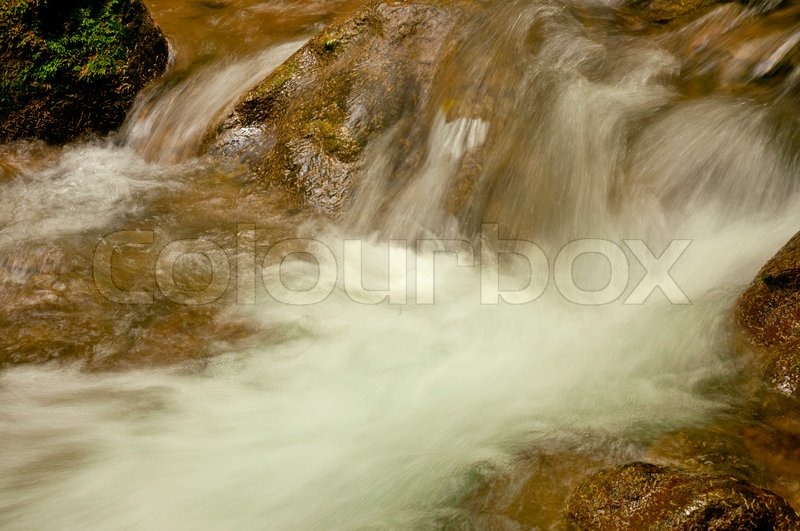 Fast flowing water in the mountain ... | Stock image | Colourbox