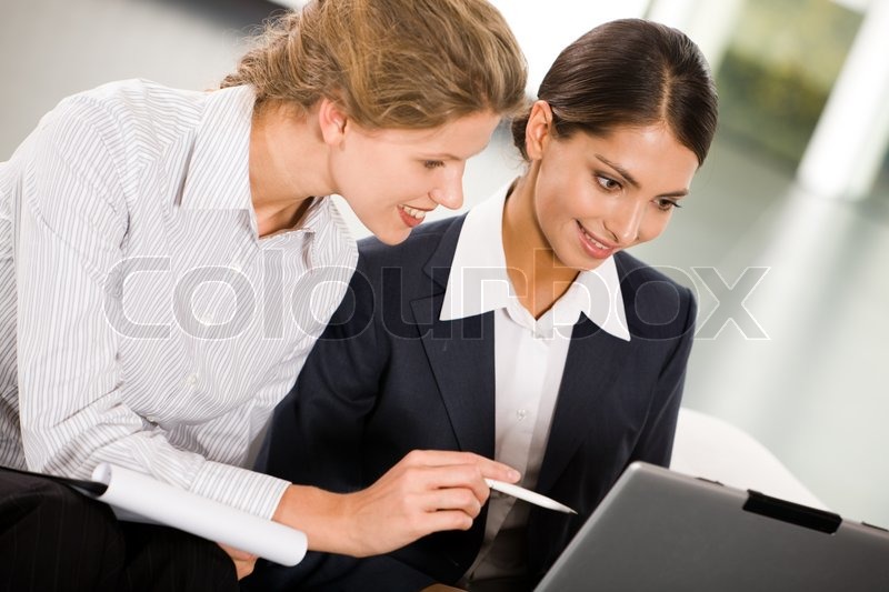 Portrait of two smiling business women ... | Stock image | Colourbox