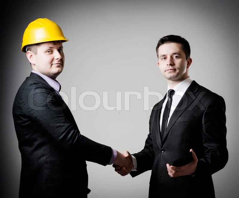 Handsome business man handshake with ... | Stock image | Colourbox
