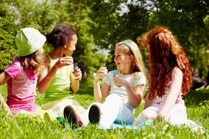 Portrait of cute girls having fun on ... | Stock image | Colourbox