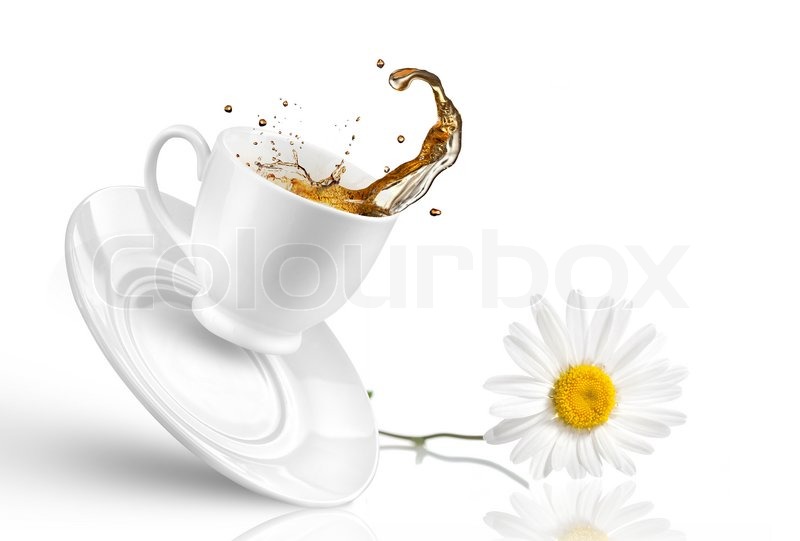 Splash of tea in the falling cup with ... | Stock image | Colourbox