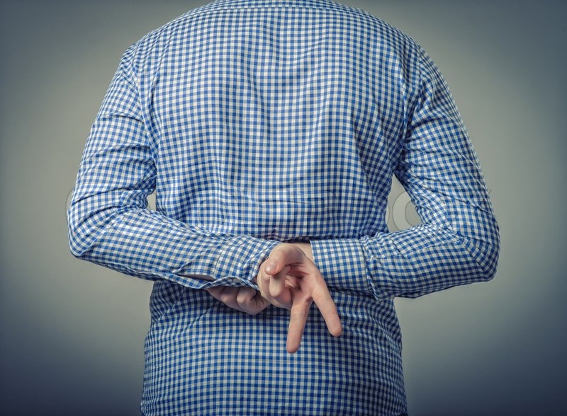 Businessman showing two fingers behind ... | Stock image | Colourbox