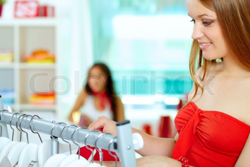 Portrait of charming girl choosing new ... | Stock image | Colourbox