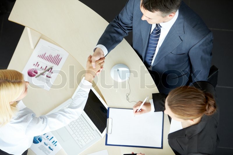 Handshaking partners | Stock image | Colourbox