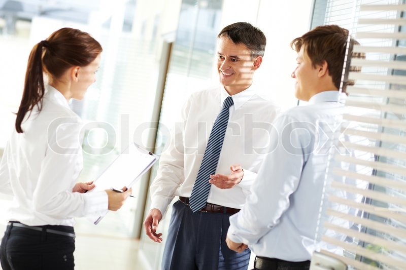 Business leader explaining to his ... | Stock image | Colourbox
