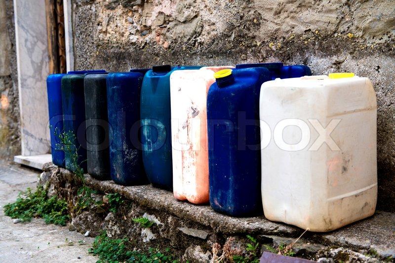 Row of colorful Jerry Cans on the ... | Stock image | Colourbox